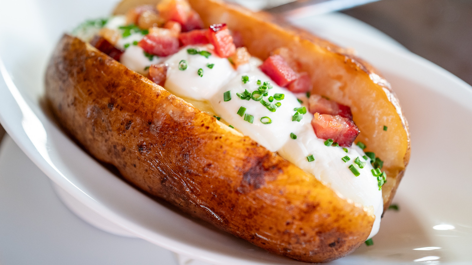 Why Baked Potatoes Taste Better In Restaurants Than At Home