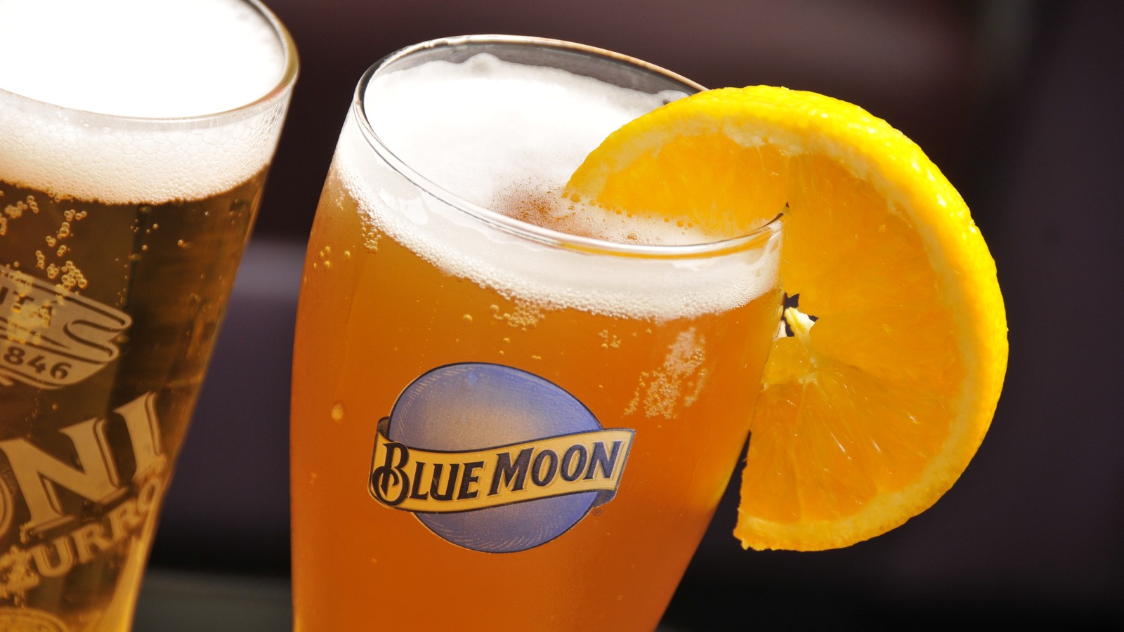 Why You'll Always Get An Orange Garnish When You Order A Blue Moon